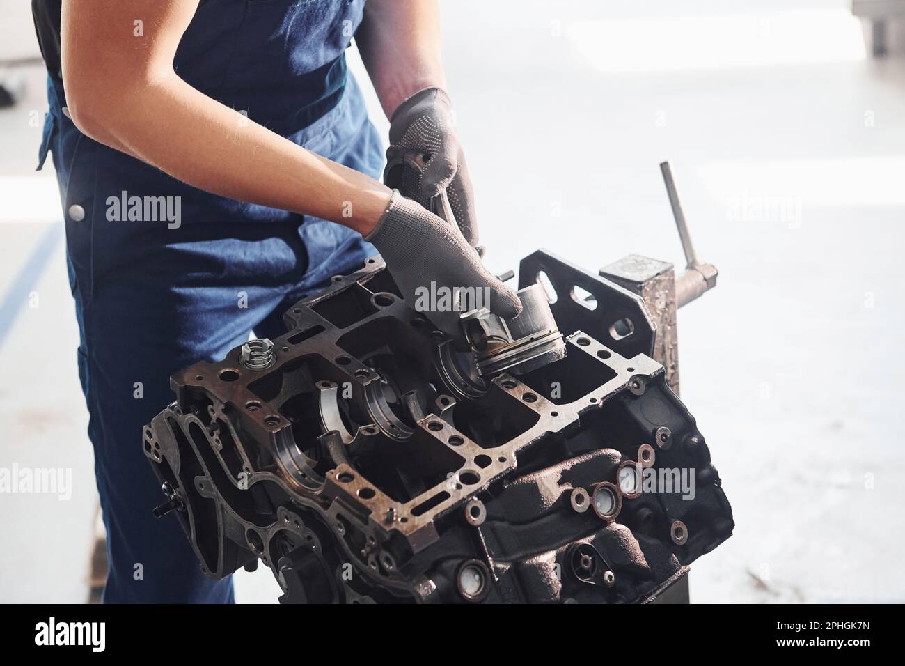 Professional repairman works with broken automobile engine Stock Photo ...