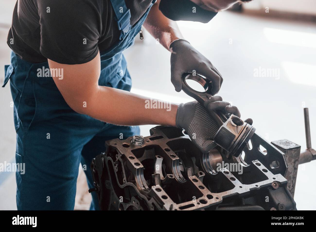 Professional repairman works with broken automobile engine Stock Photo ...