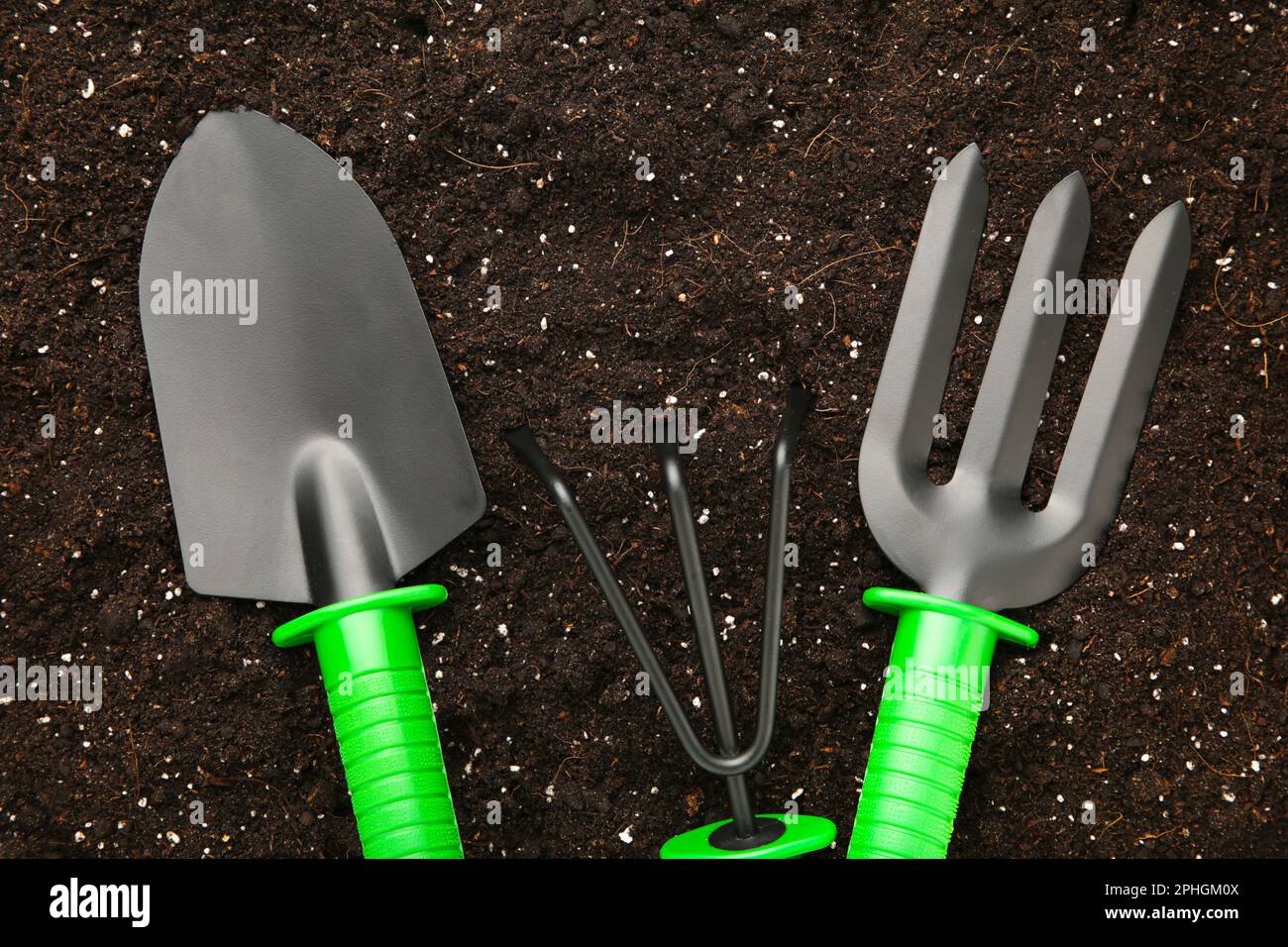 Set of plant care utensils on soil with copy space, top view Stock ...