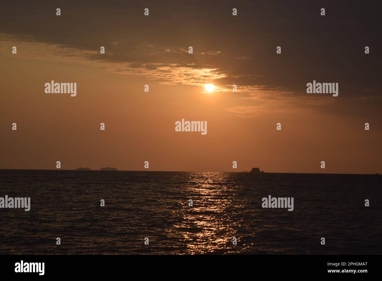 The glimmering golden light from the sun reflects on the beautiful ...