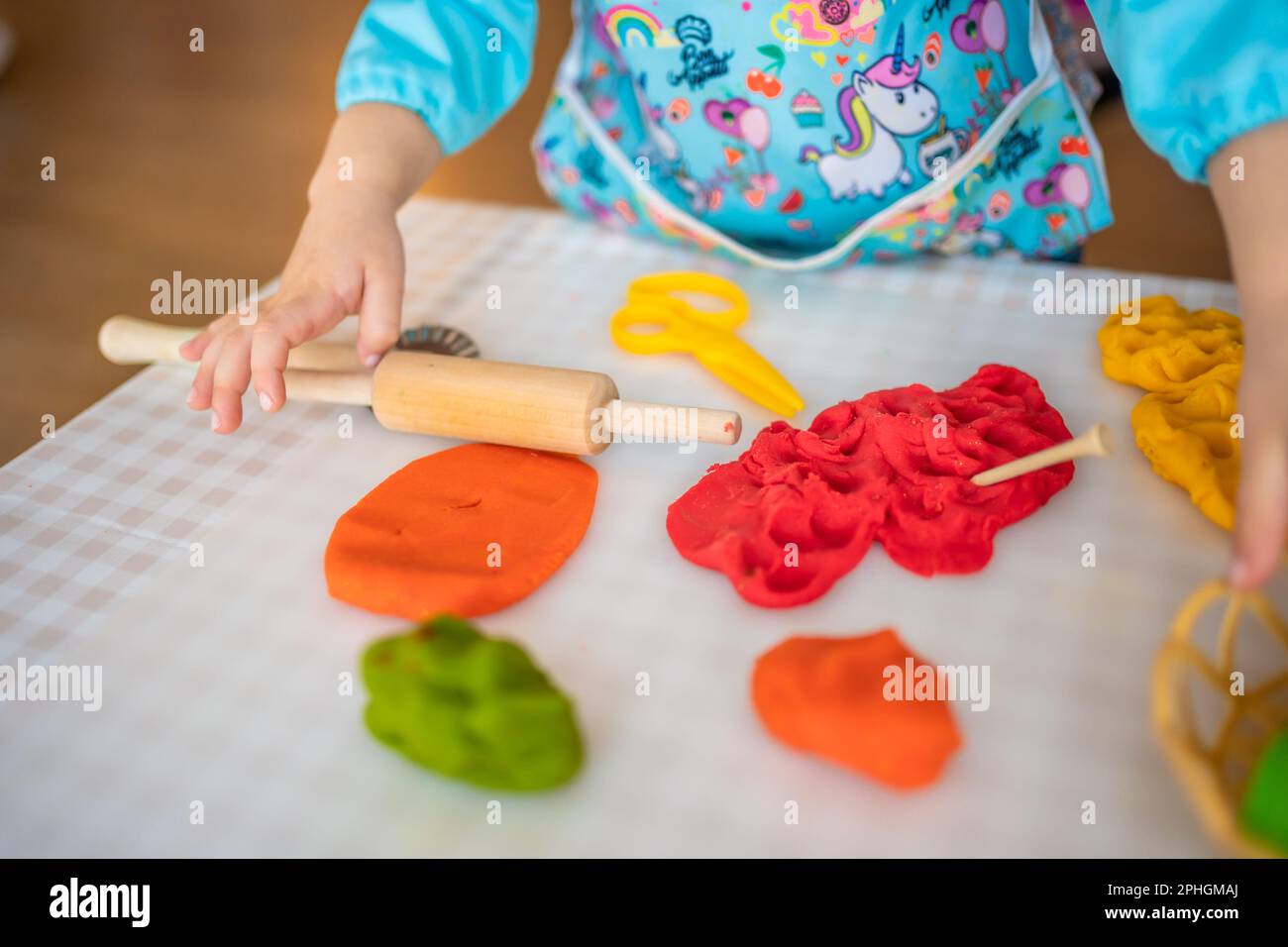 A little girl playing with plasticine. Sensory development and ...