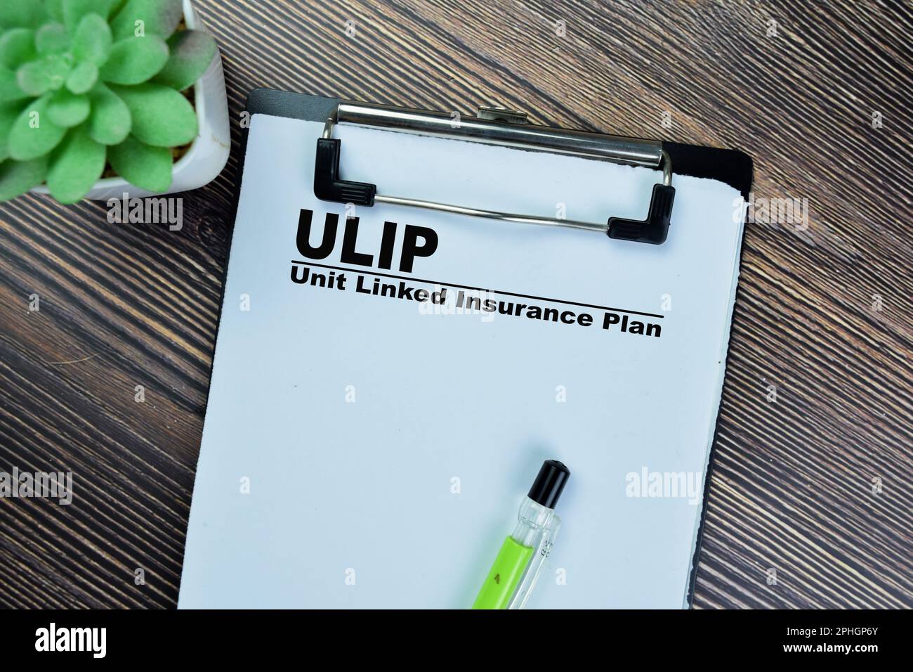 Concept of ULIP - Unit Linked Insurance Plan write on paperwork on a ...