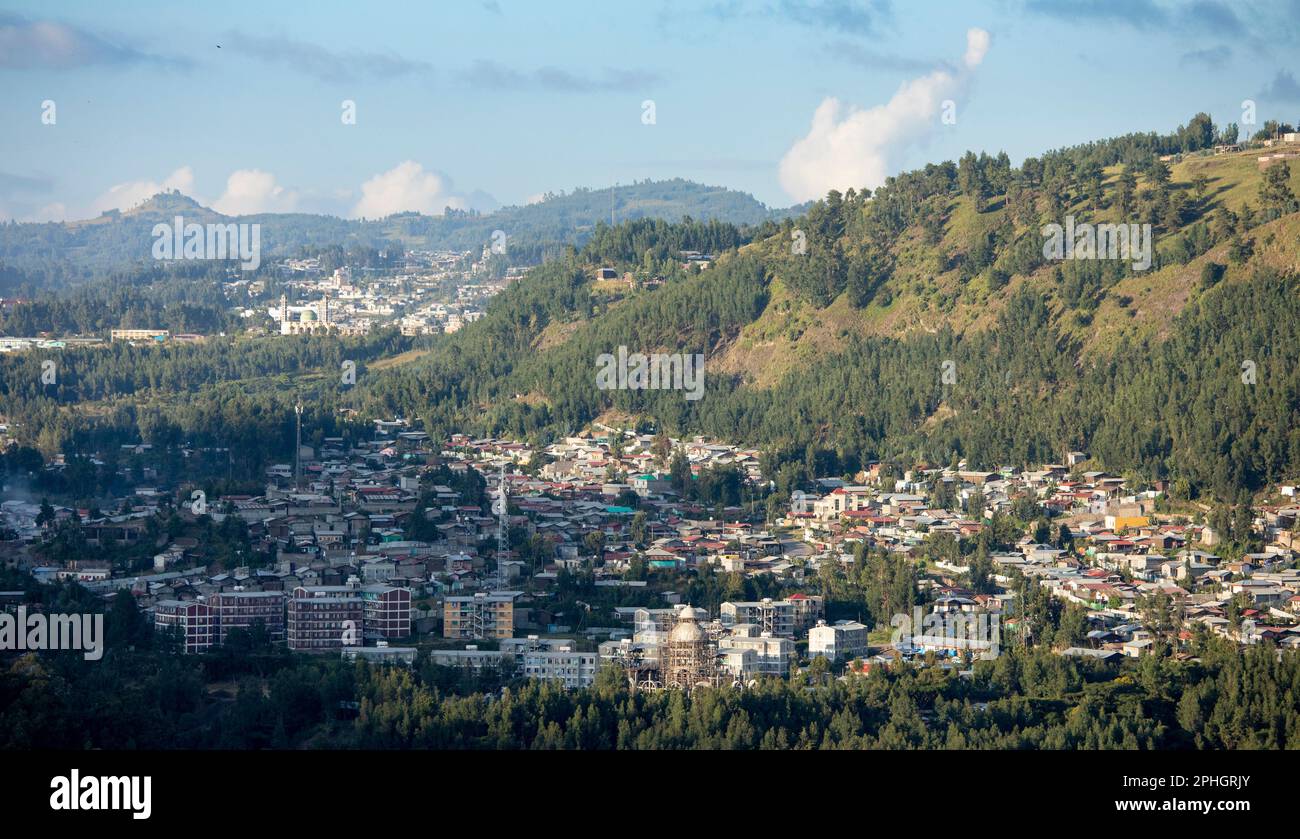 A low aerial view of the city of Dessie, Ethiopia, surrounded by ...
