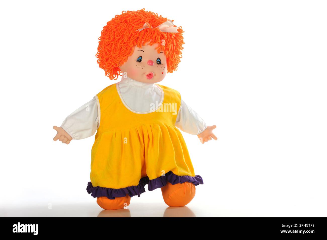 rag doll girl with orange hair in a yellow jumpsuit suit isolated on ...