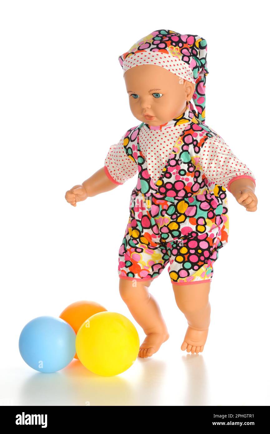 doll cute little girl in colorful clothes with colorfull ballons is on ...