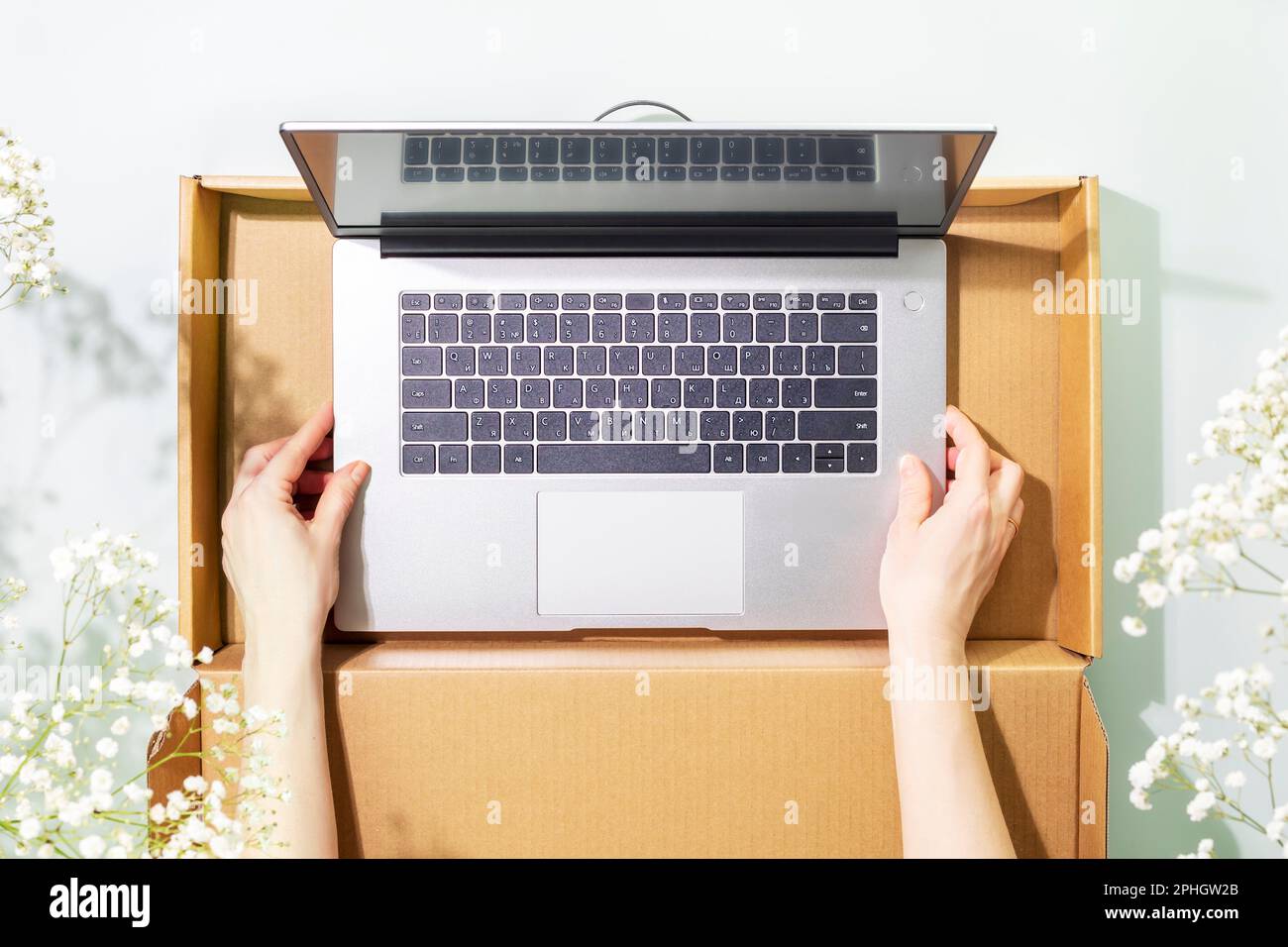 Buying and delivering new laptop. Romantic overhead shot of womans ...