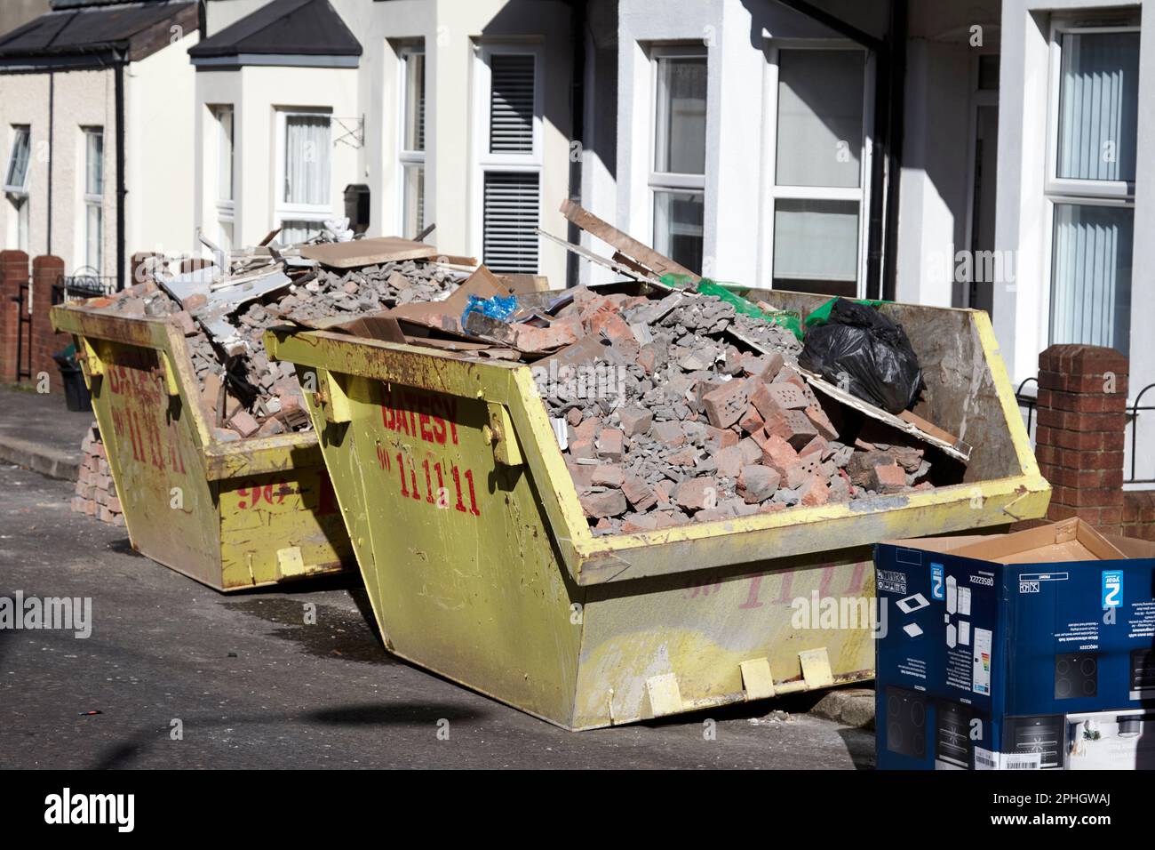 builders skips full of building rubble old bricks during redevelopment ...