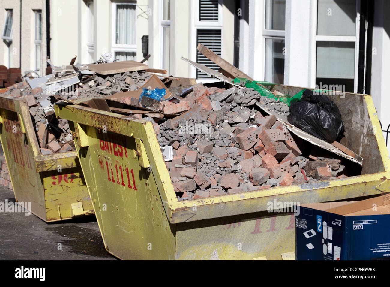 builders skips full of building rubble old bricks during redevelopment ...