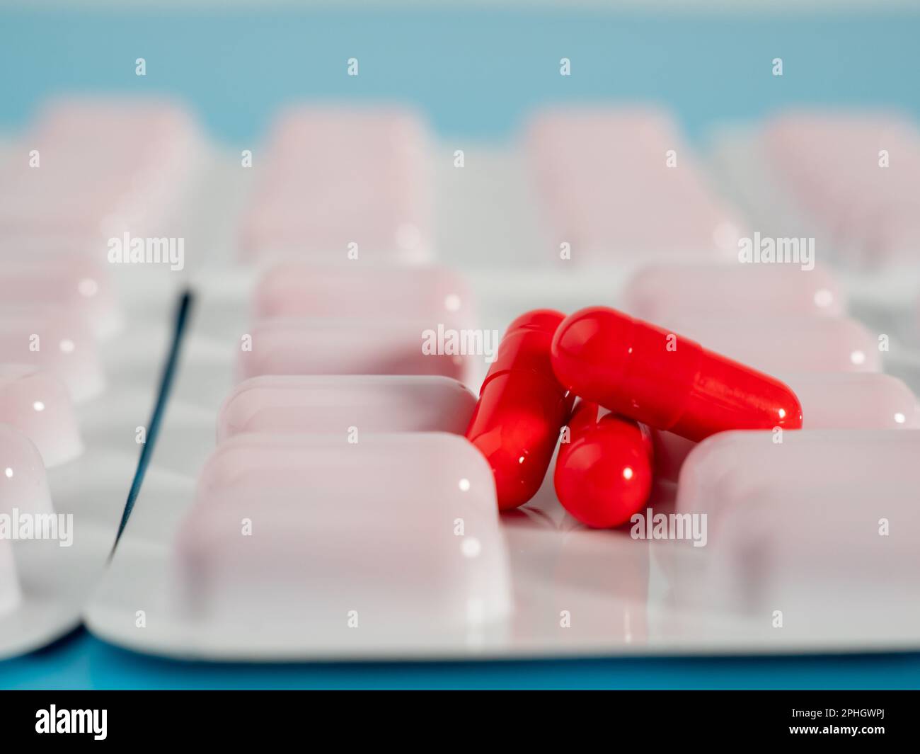 Red medical capsules. Capsules in a blister pack. Close-up Stock Photo ...