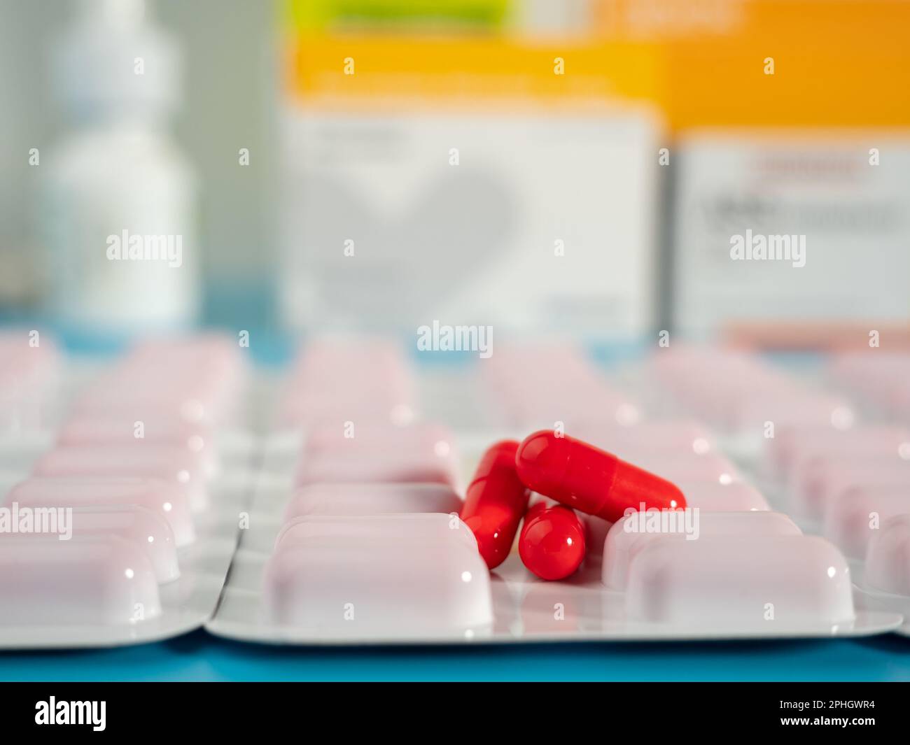 Red medical capsules. Capsules in a blister pack. Close-up Stock Photo ...