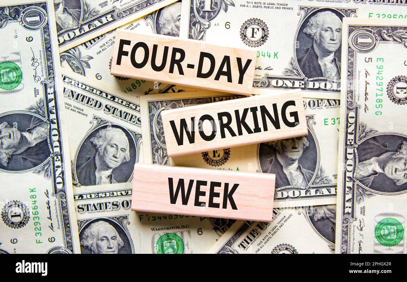 Four-day working week symbol. Concept words Four-day working week on wooden block on a beautiful ...