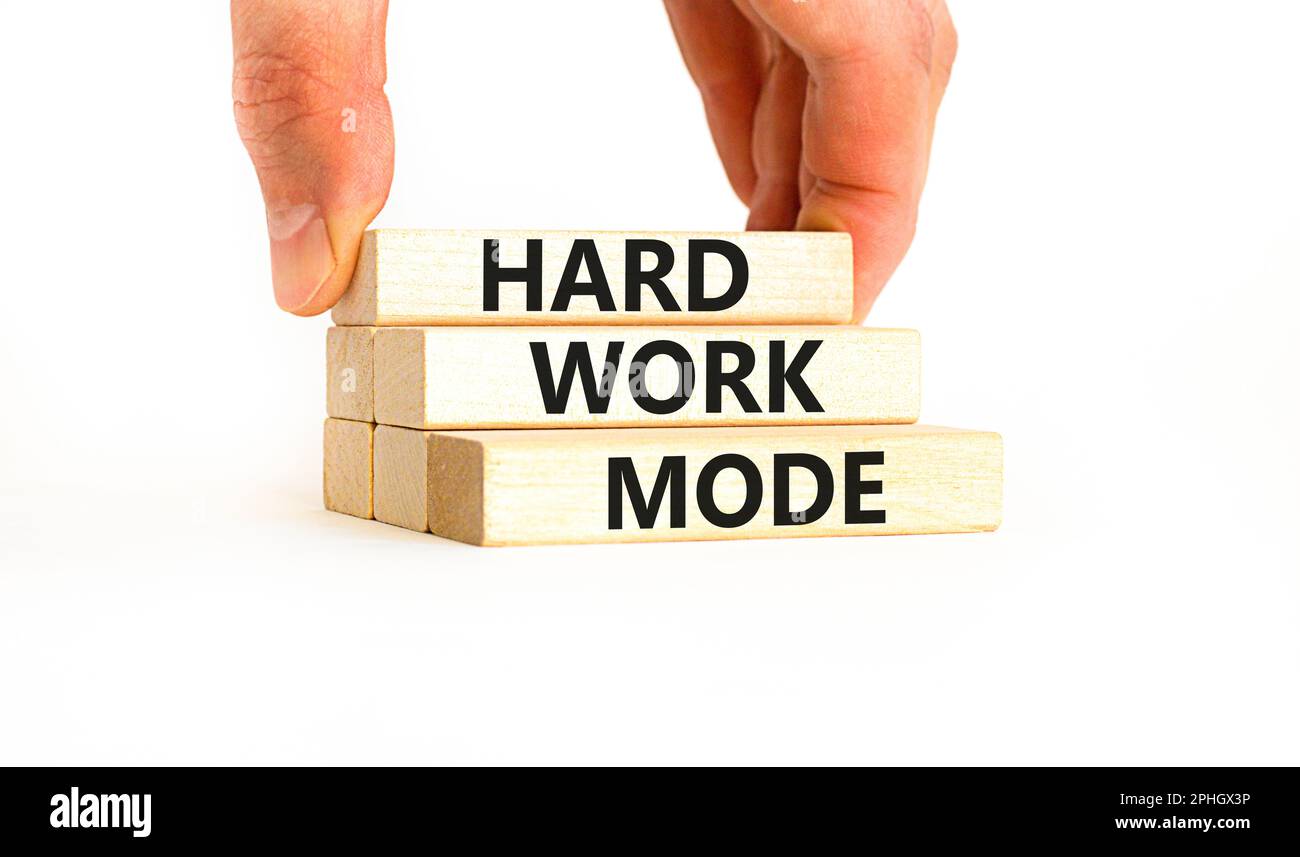 Hard work mode symbol. Concept words Hard work mode on wooden block on ...