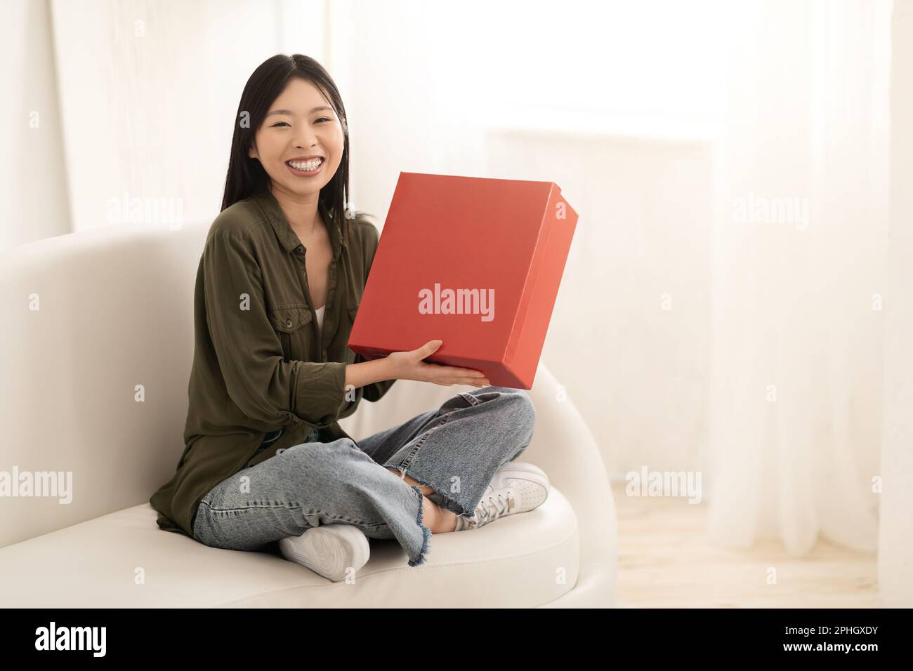 Happy asian woman customer receive good parcel, home interior Stock ...