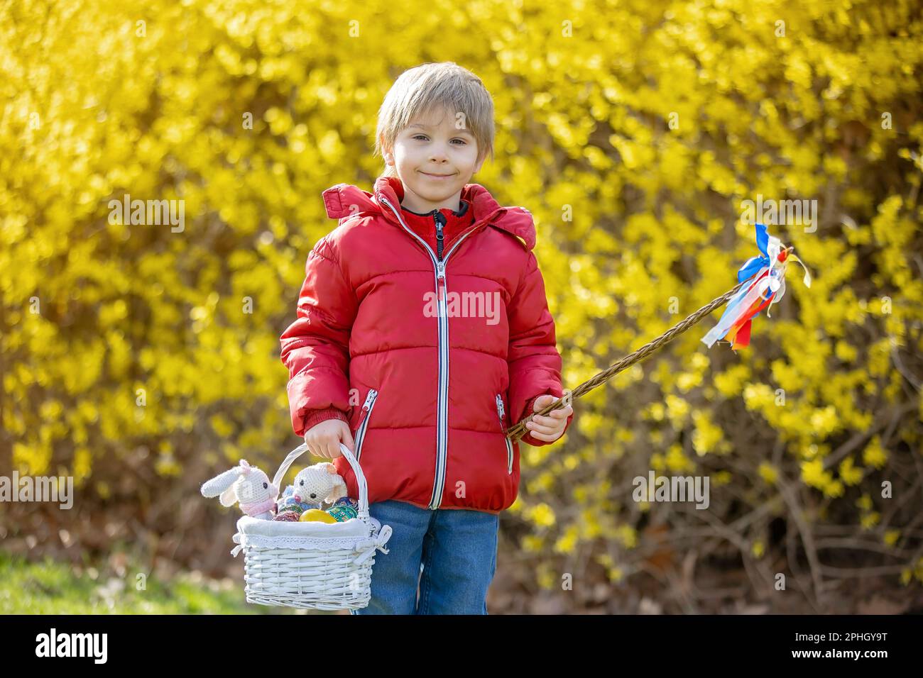 Cute preschool child, boy, holding handmade braided whip made from ...