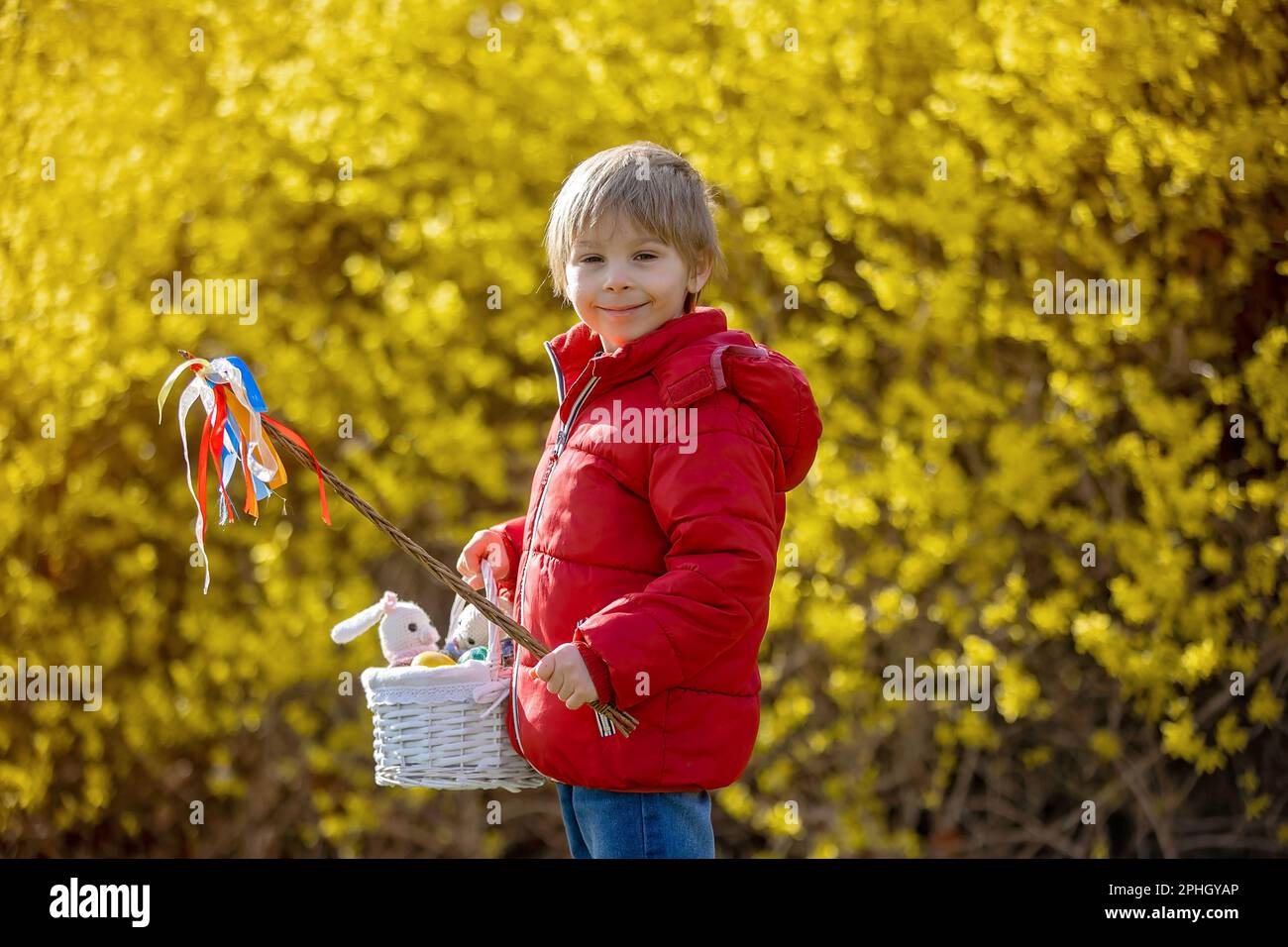 Cute preschool child, boy, holding handmade braided whip made from ...