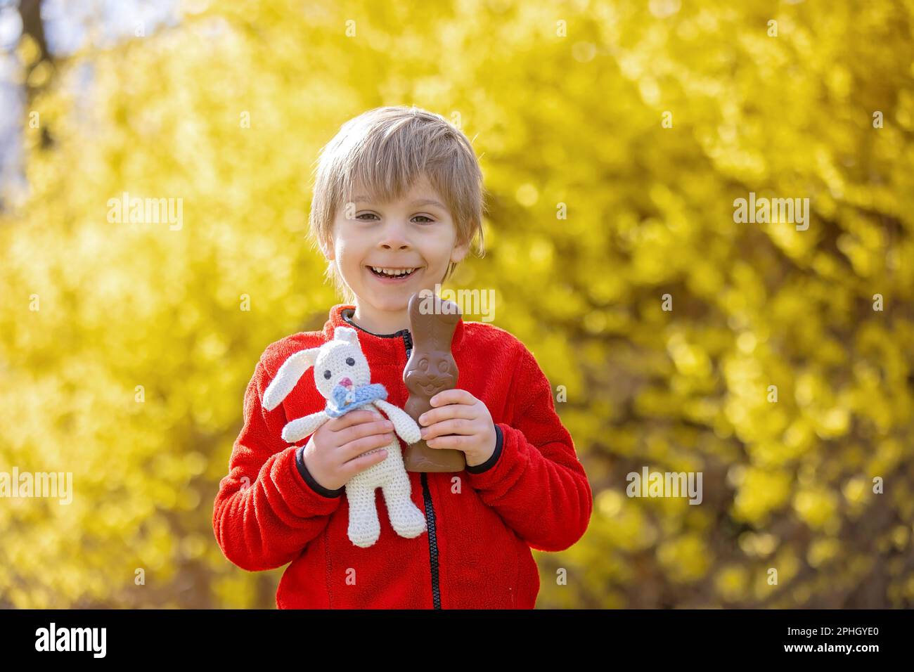 Cute preschool child, boy, holding handmade braided whip made from ...