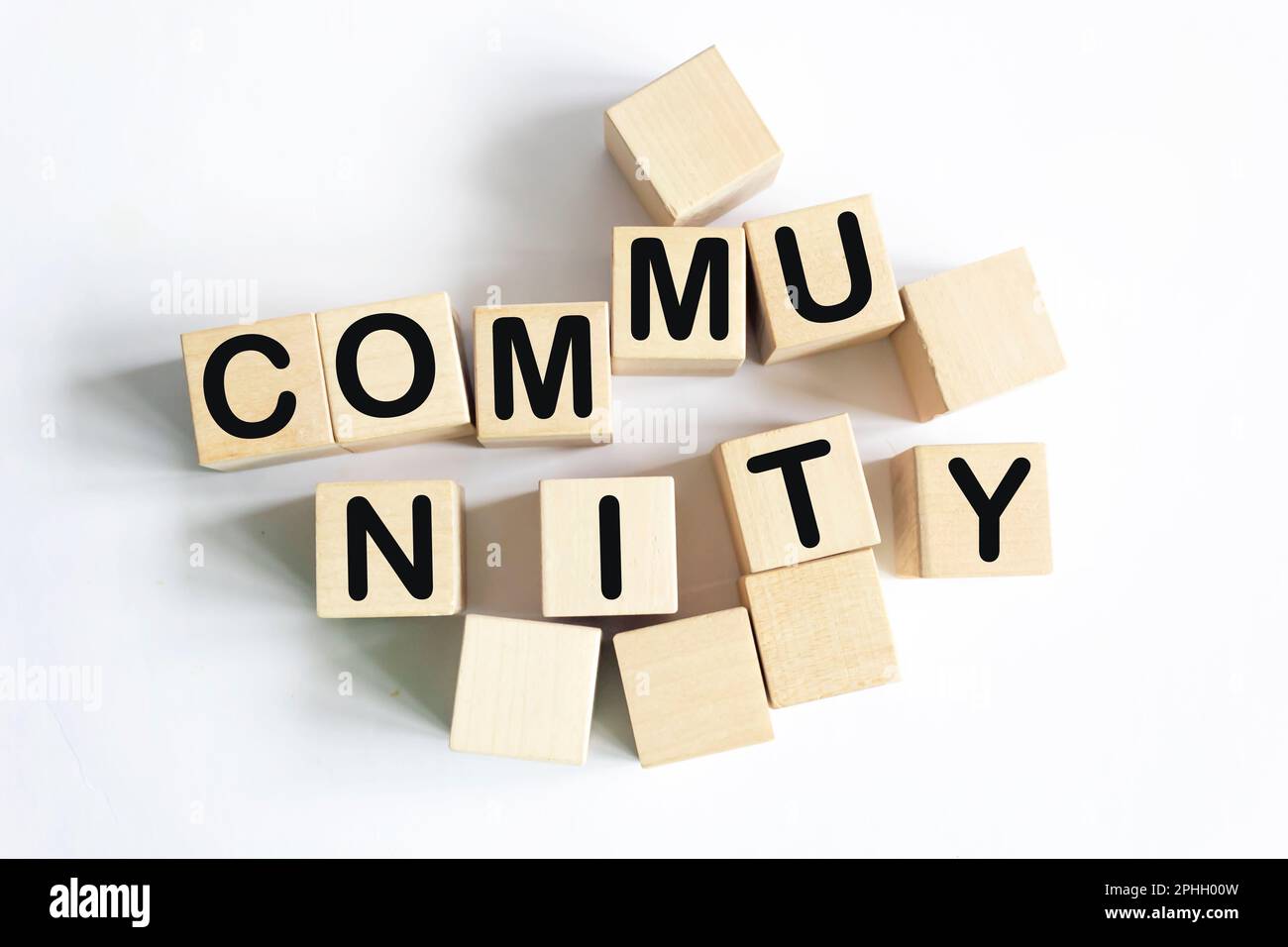 The word Community is written on a wooden block. Community text on ...