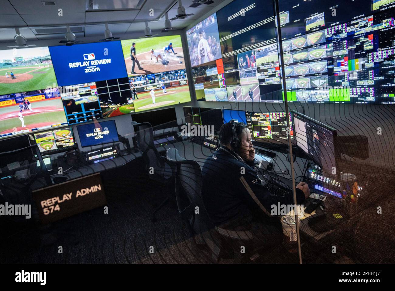 An employee works inside an administrative room at a Replay Review ...