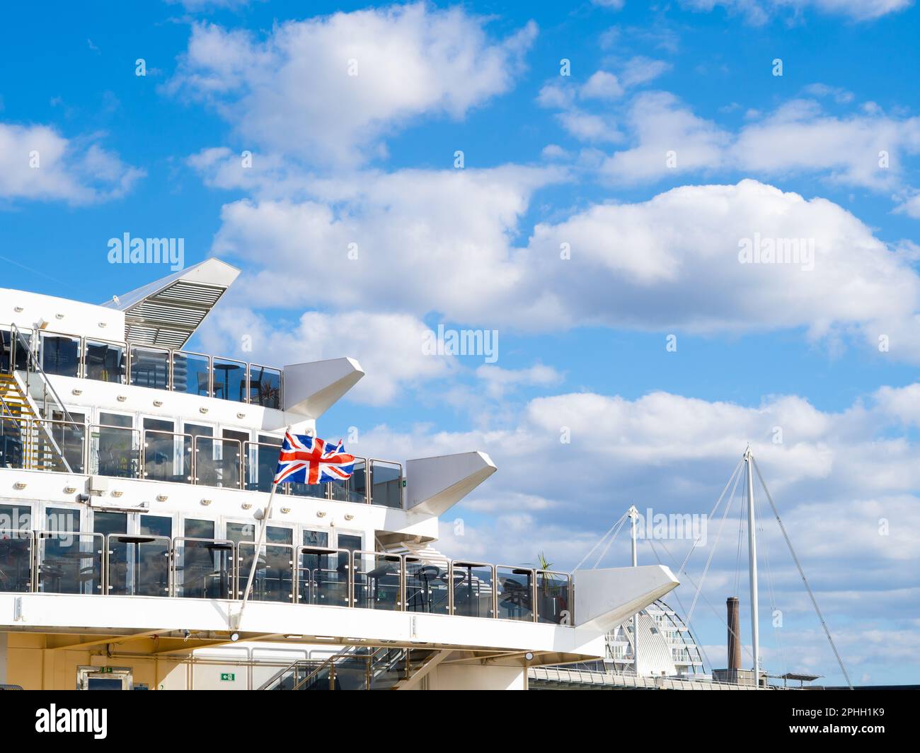 britain flag waving in blue sky background Stock Photo - Alamy