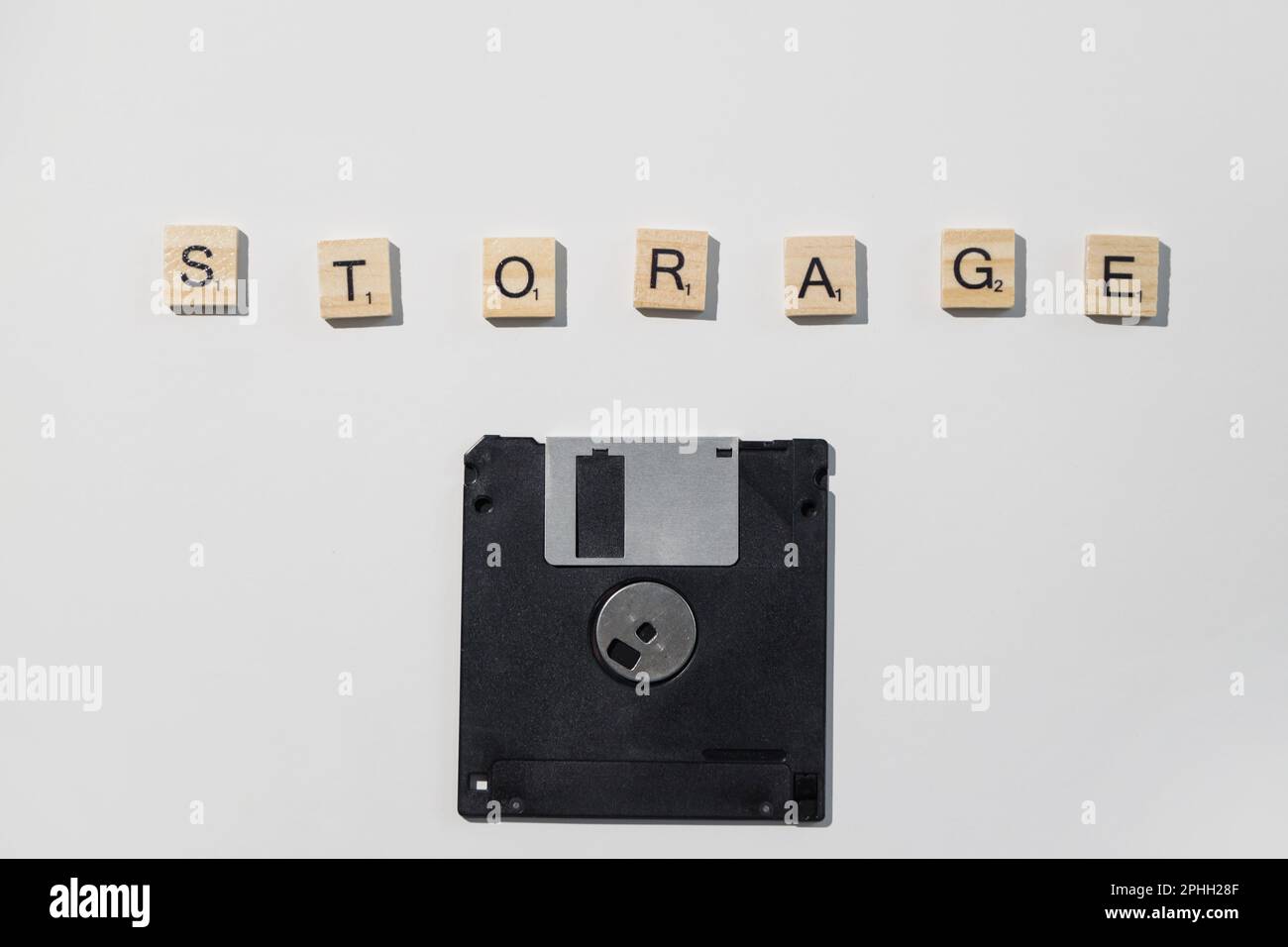 Black floppy disk storage concept on white background. Top view, flat ...