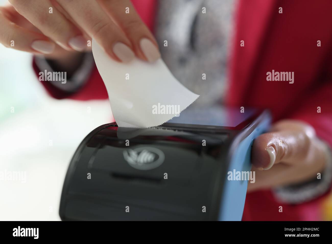 Female cashier tears out check form POS terminal in store Stock Photo ...