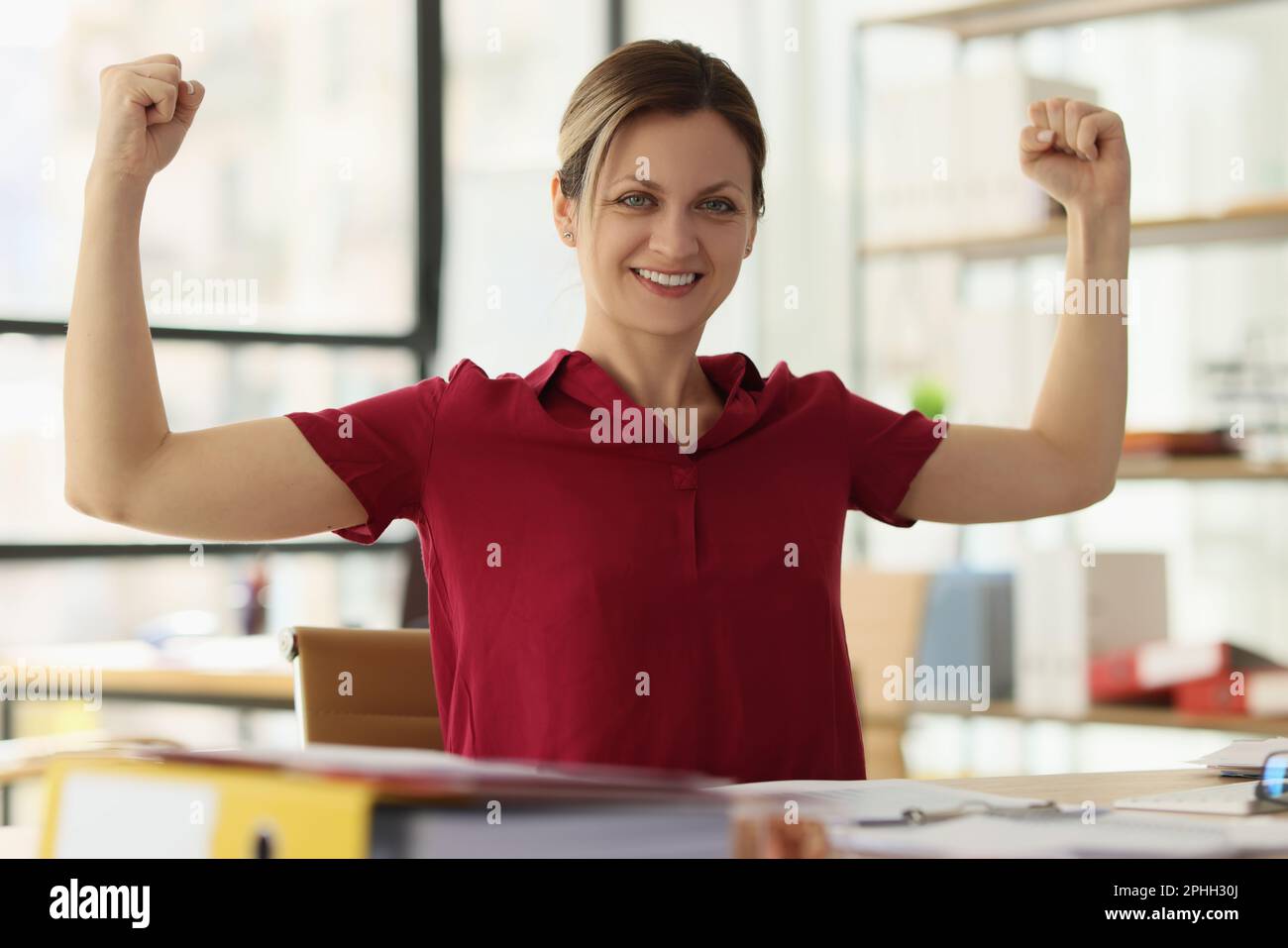 Strong woman shows muscles hi-res stock photography and images - Alamy