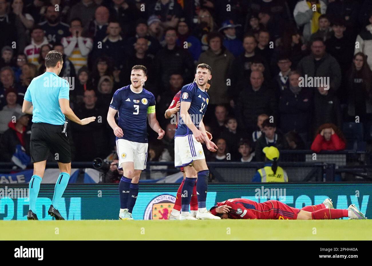 Spain's Pedro Porro reacts to a challenge from Scotland's Andrew ...
