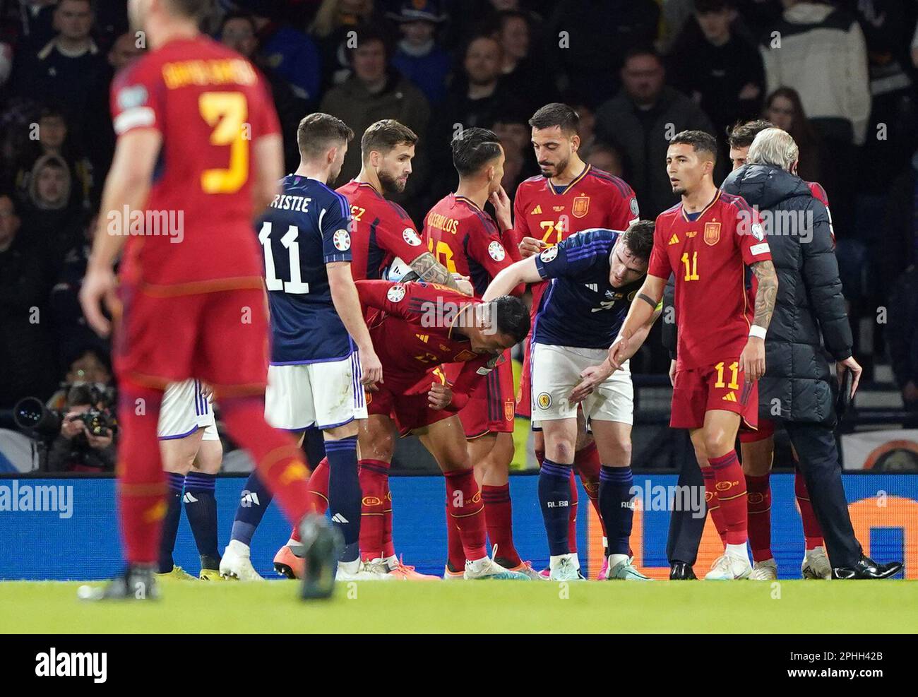 Scotland's Andrew Robertson speaks to Spain's Pedro Porro during the ...