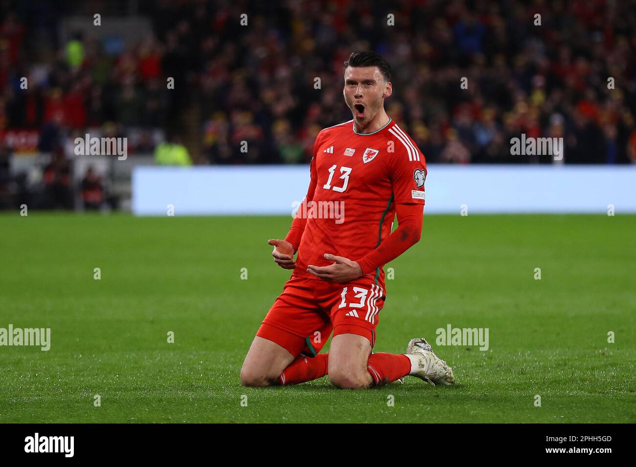Cardiff, UK. 28th Mar, 2023. Kieffer Moore of Wales celebrates after he ...