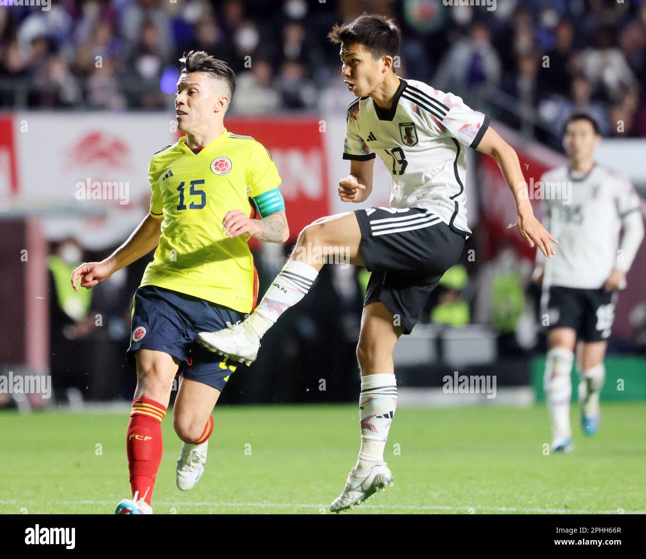 Osaka, Japan. 28th Mar, 2023. Japan's Takuma Nishimura (R) shoots the ...