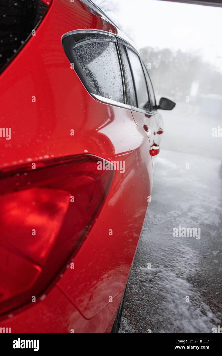 Side of a red car being washed Stock Photo - Alamy