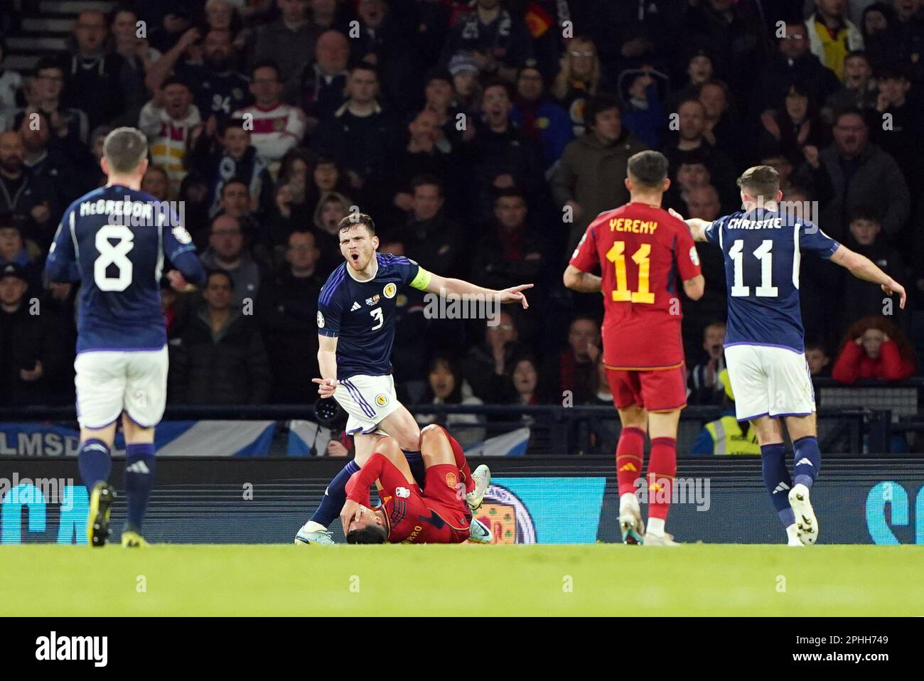 Spain's Pedro Porro reacts to a challenge from Scotland's Andrew ...