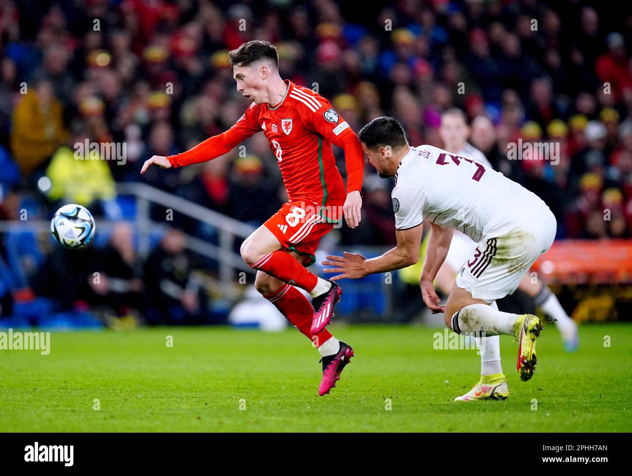 Wales' Harry Wilson (left) challenges Latvia's Marcis Oss resulting in ...