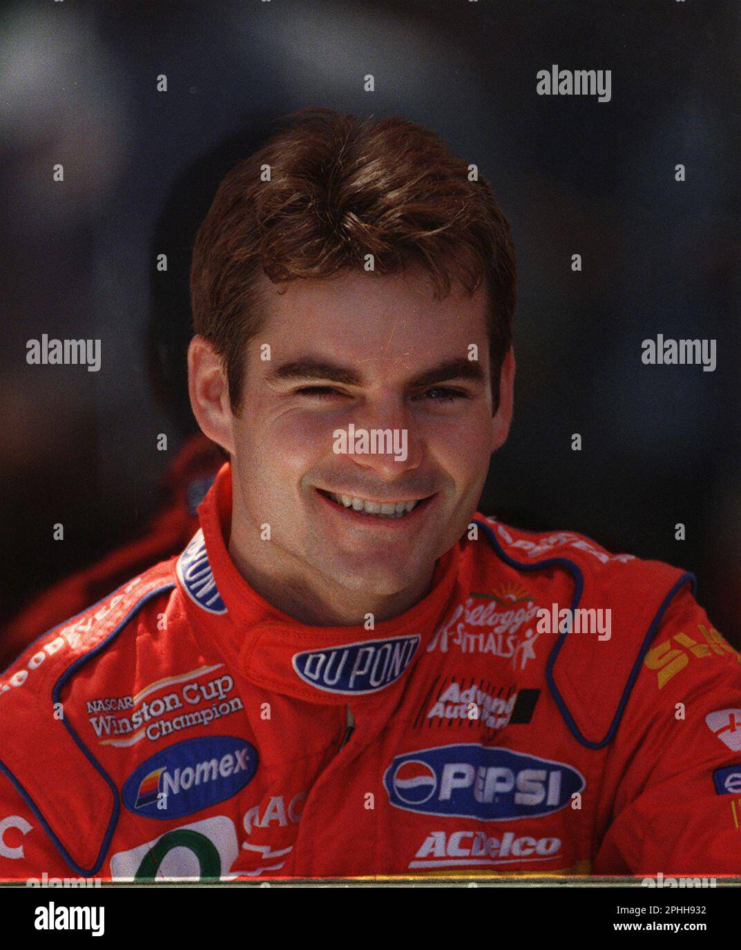 NASCAR 5/C/25JUN99/SP/LS --- Jeff Gordon takes a break during practice ...