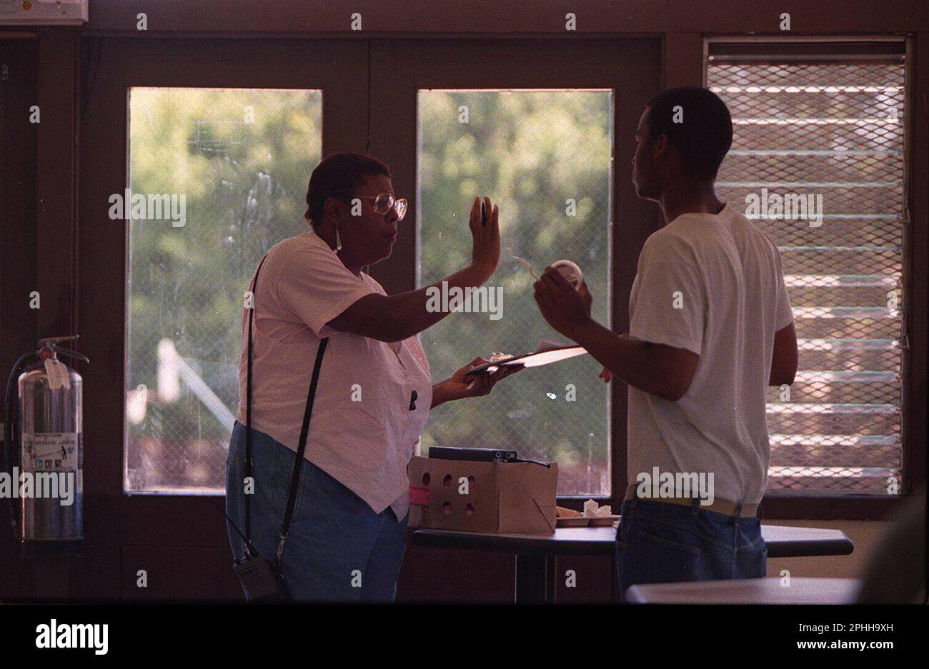 LOG CABIN 5/C/20AUG96/CD/LS Liller B. Jackson, counselor, stops one ...