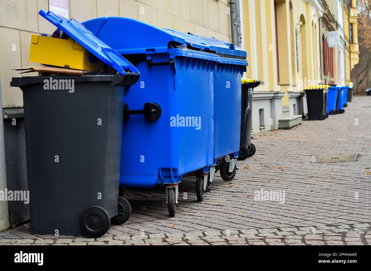 Garbage containers on city street Stock Photo - Alamy
