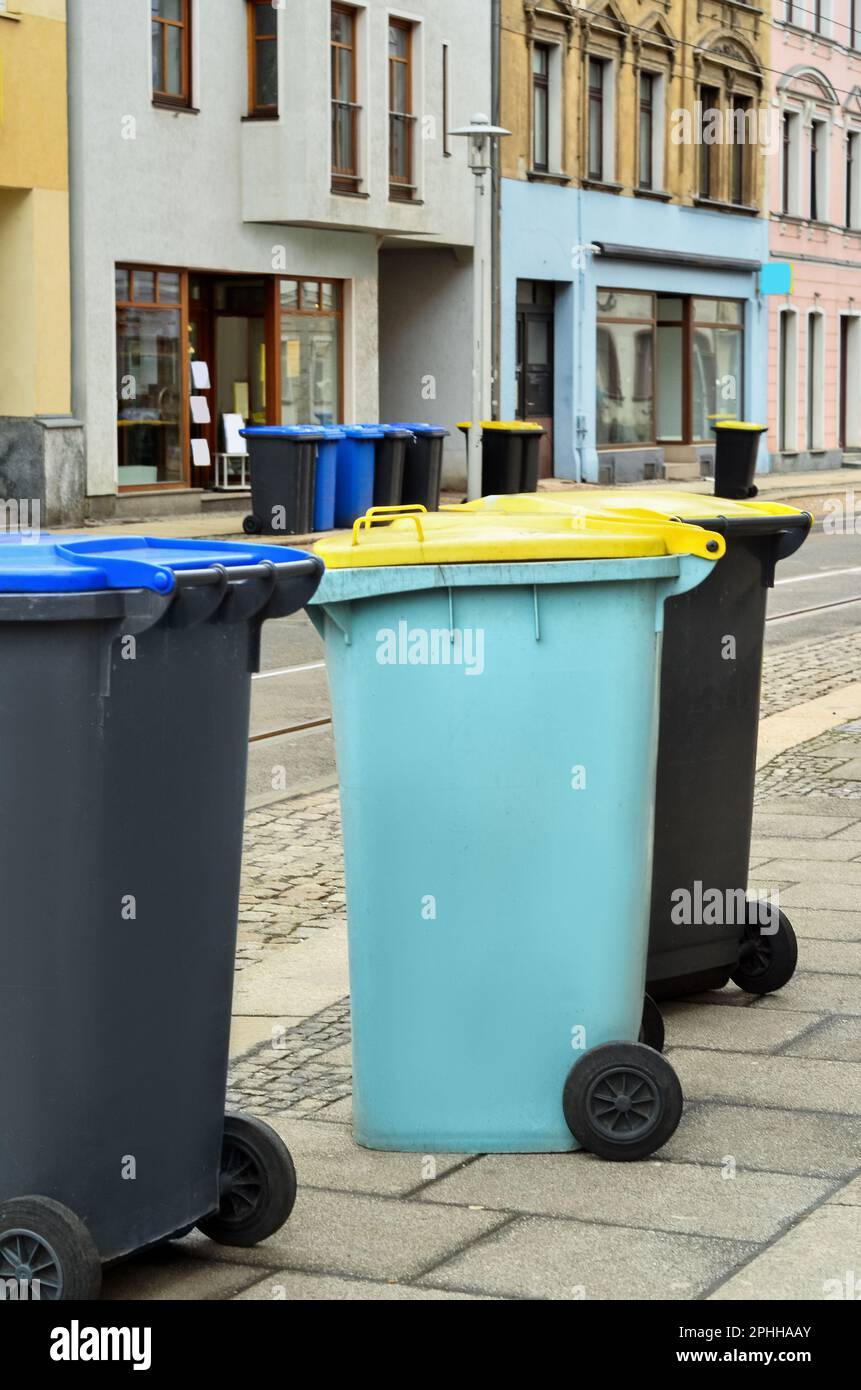 Garbage containers on city street Stock Photo - Alamy
