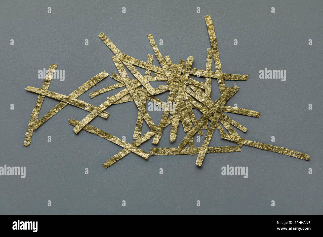 Cut nori sheets on dark background Stock Photo - Alamy