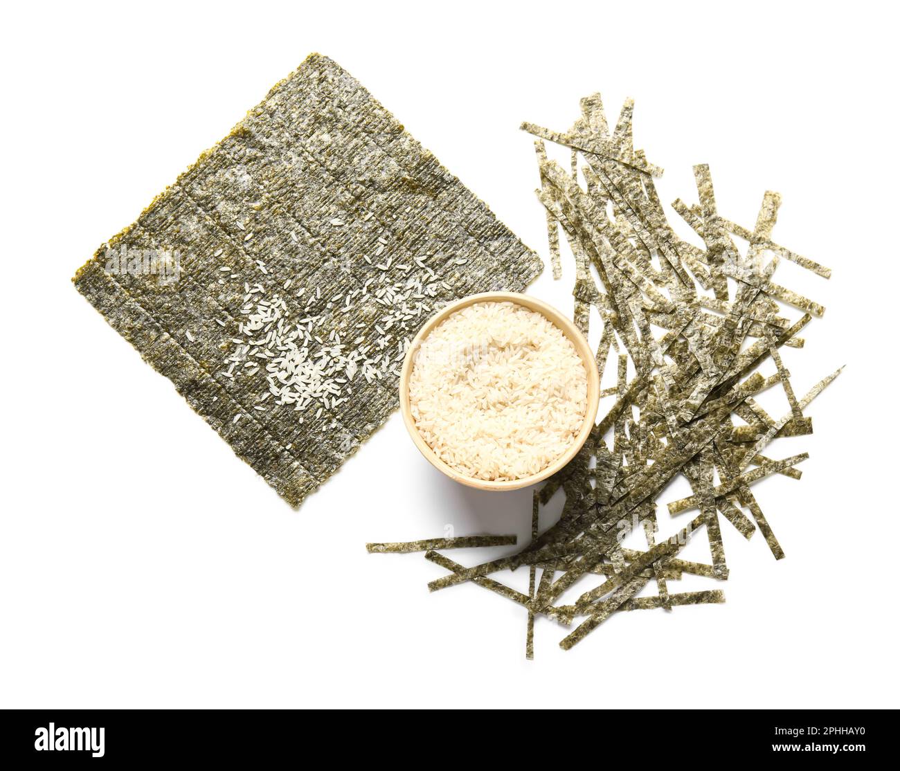 Bowl of raw rice and nori sheets on white background Stock Photo - Alamy