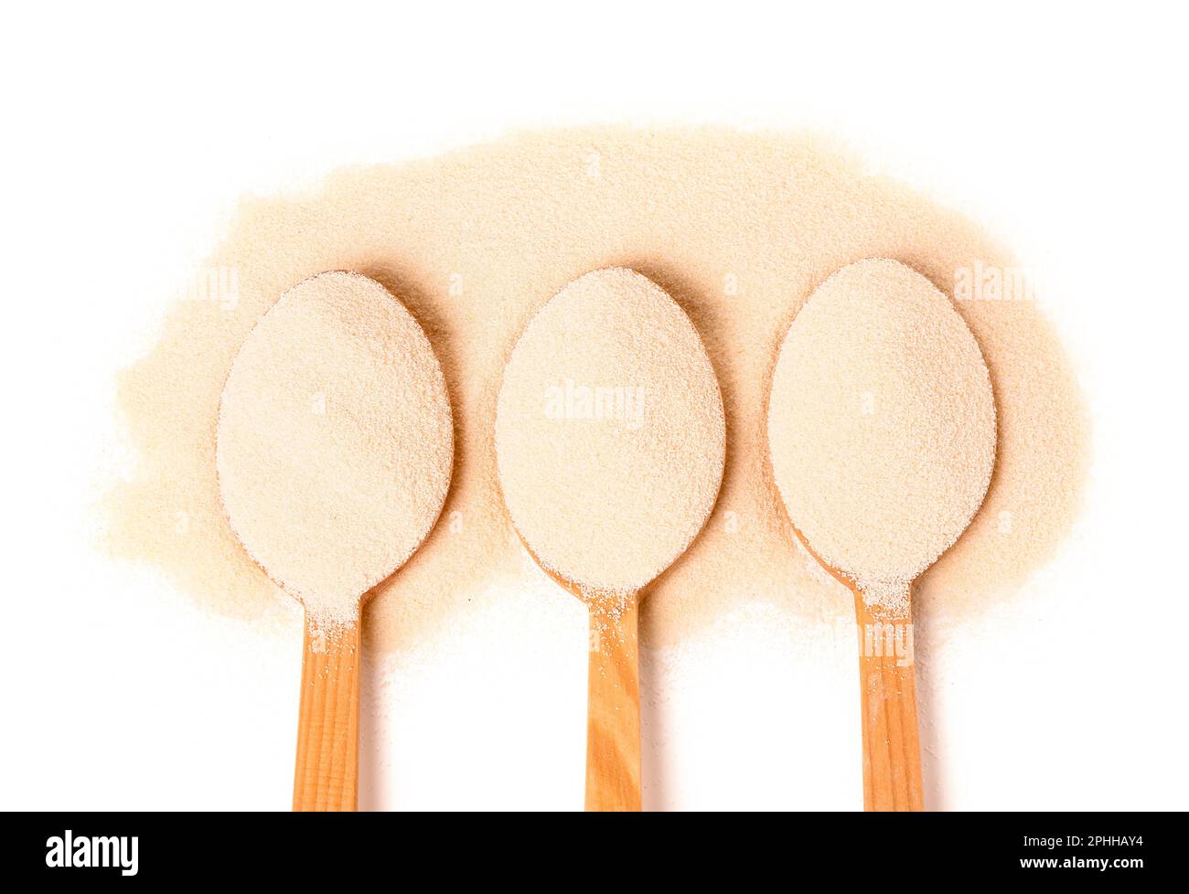 Spoons with raw semolina on white background, closeup Stock Photo - Alamy