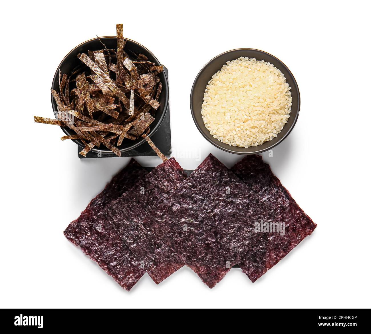 Natural nori sheets with rice isolated on white background Stock Photo ...