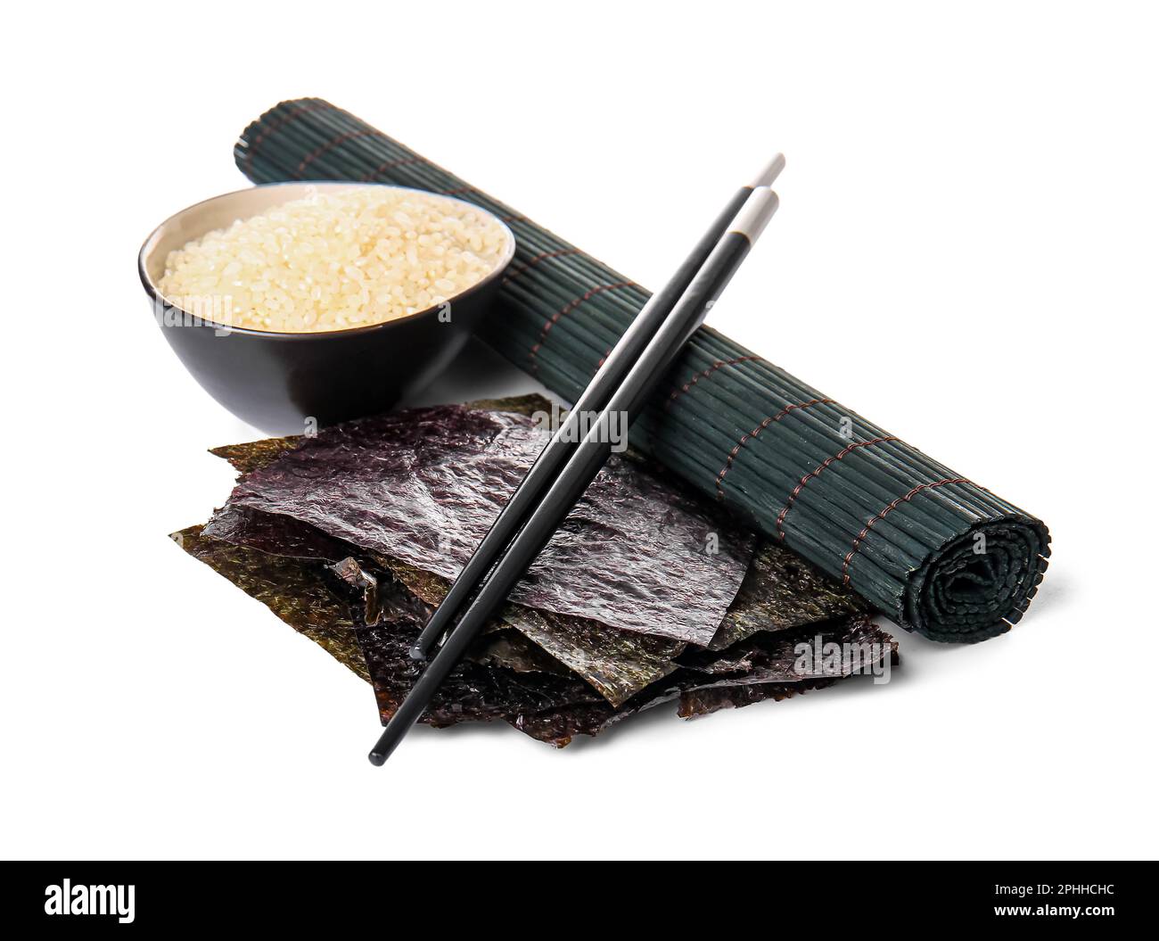 Natural nori sheets, chopsticks, bamboo mat and bowl of rice isolated ...