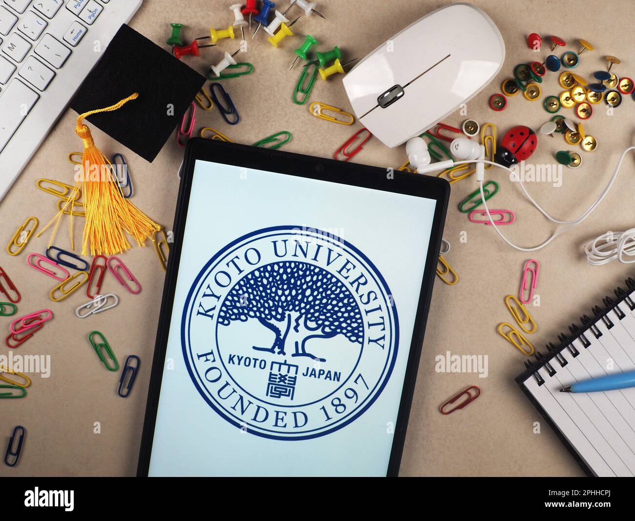 In this photo illustration, Kyoto University logo seen displayed on a ...