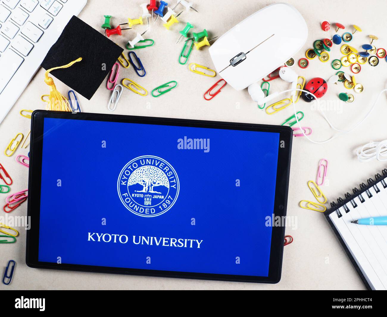 In this photo illustration, Kyoto University logo seen displayed on a ...