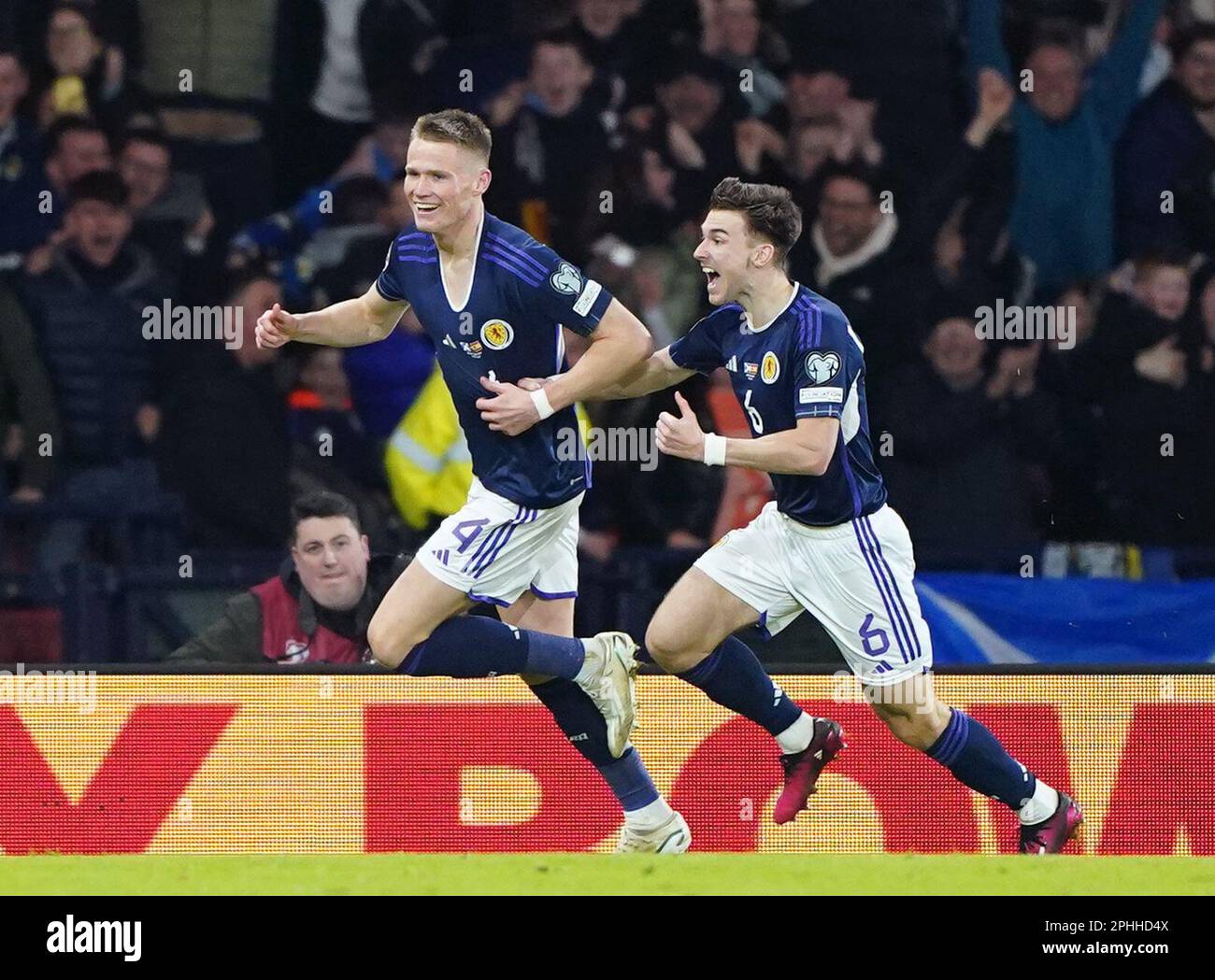 Scotland's Scott McTominay (left) celebrates scoring their side's ...