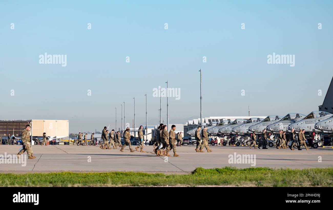 Desert Lightning Team members walk along the flight line in search of ...
