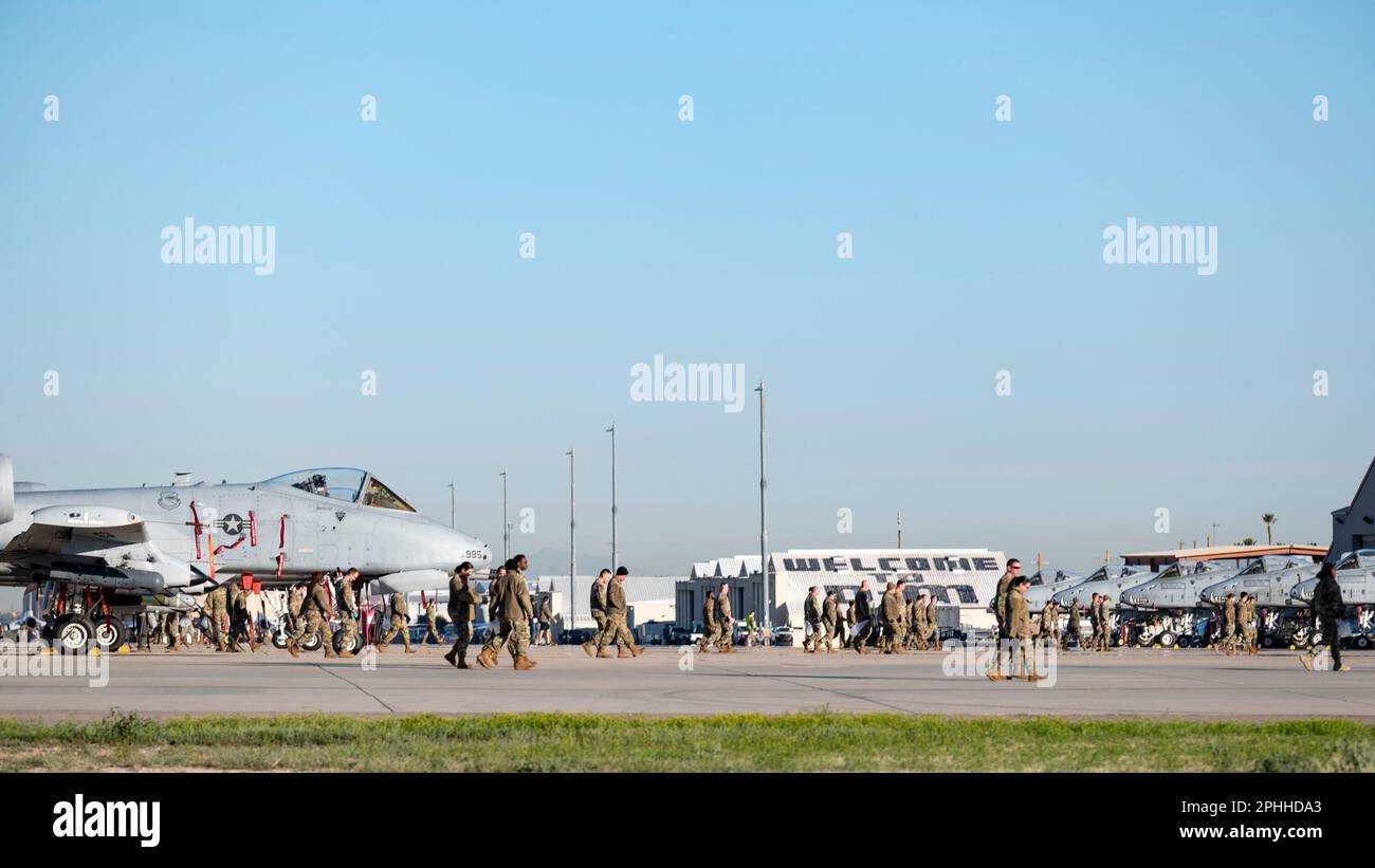 Desert Lightning Team members walk along the flight line in search of ...