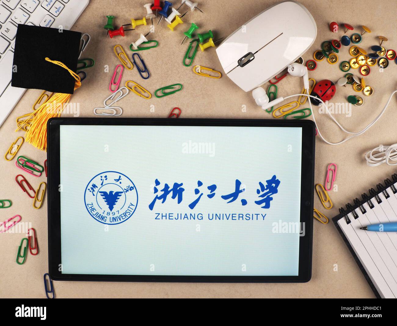 In this photo illustration, Zhejiang University logo seen displayed on a tablet Stock Photo - Alamy