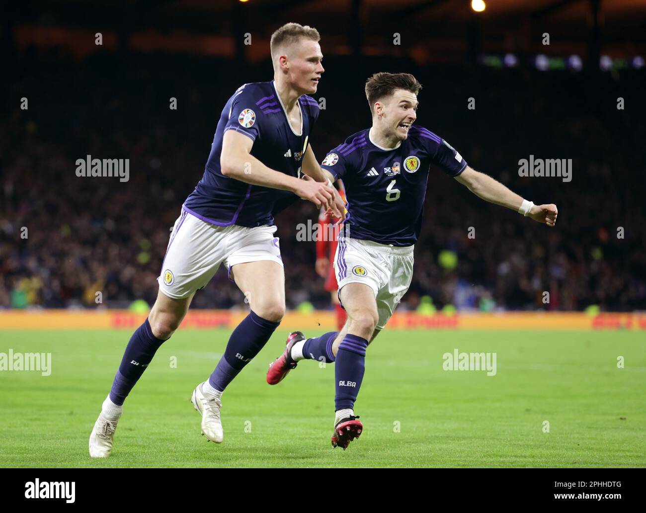 Scotland's Scott McTominay (left) celebrates scoring their side's ...
