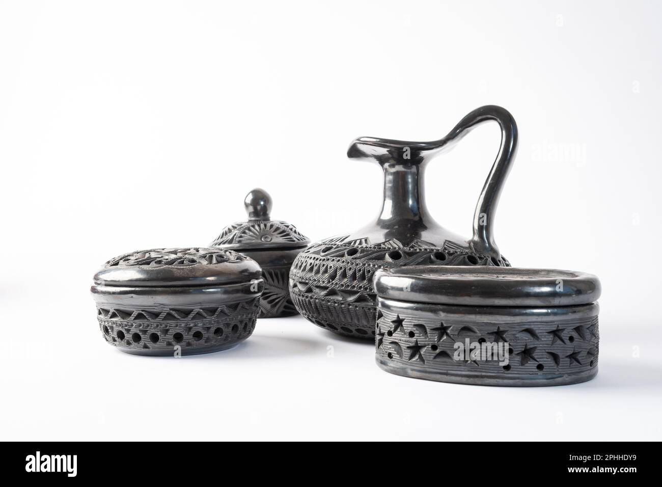 Typical Mexican handicraft. Set of black clay pots of different shapes ...